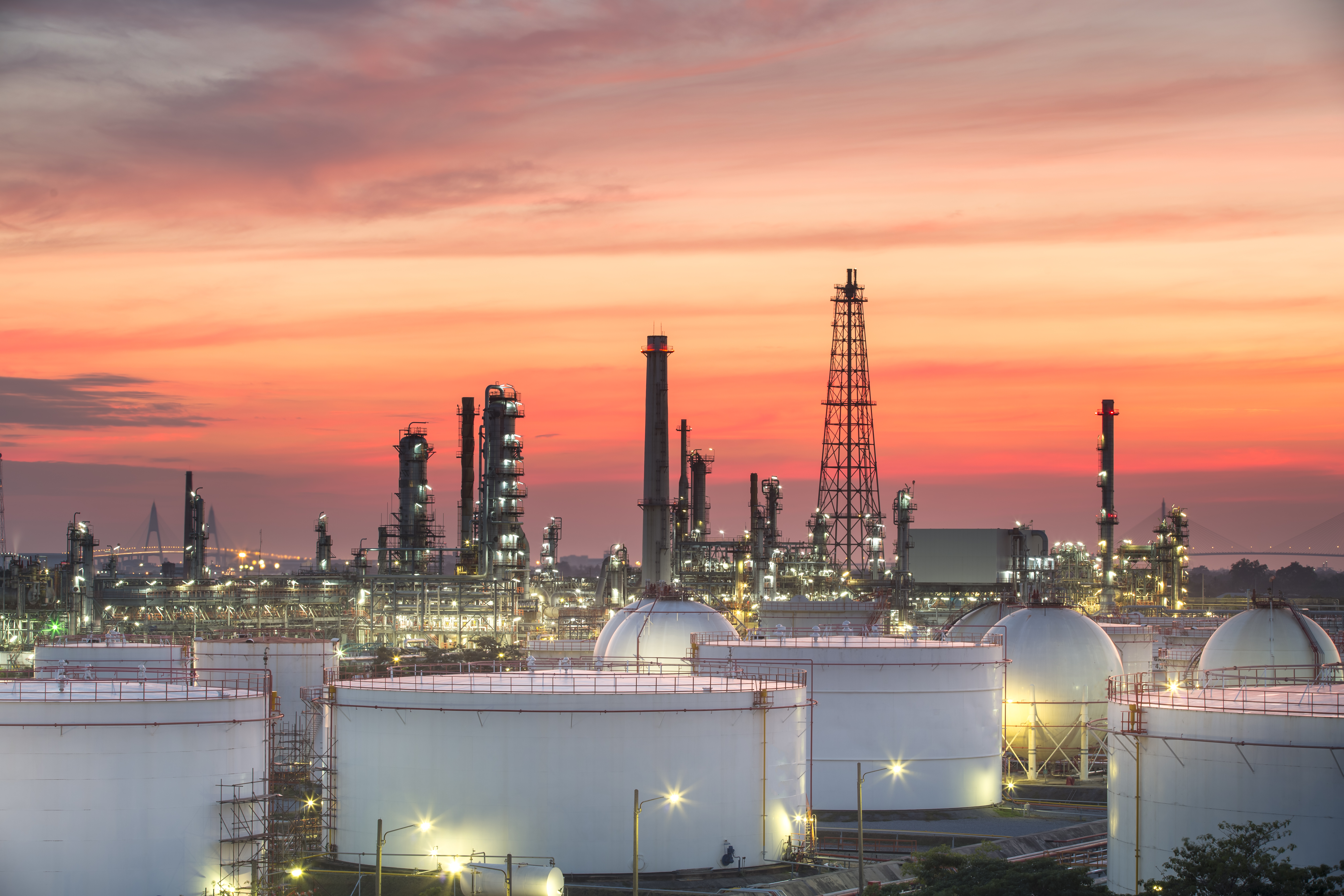 ESG Matters Oil and gas industry – refinery at sunset – factory ...
